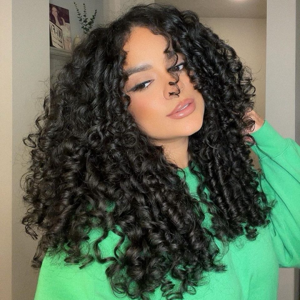 22 Flattering Ways To Pair Curtain Bangs With Curly Hair