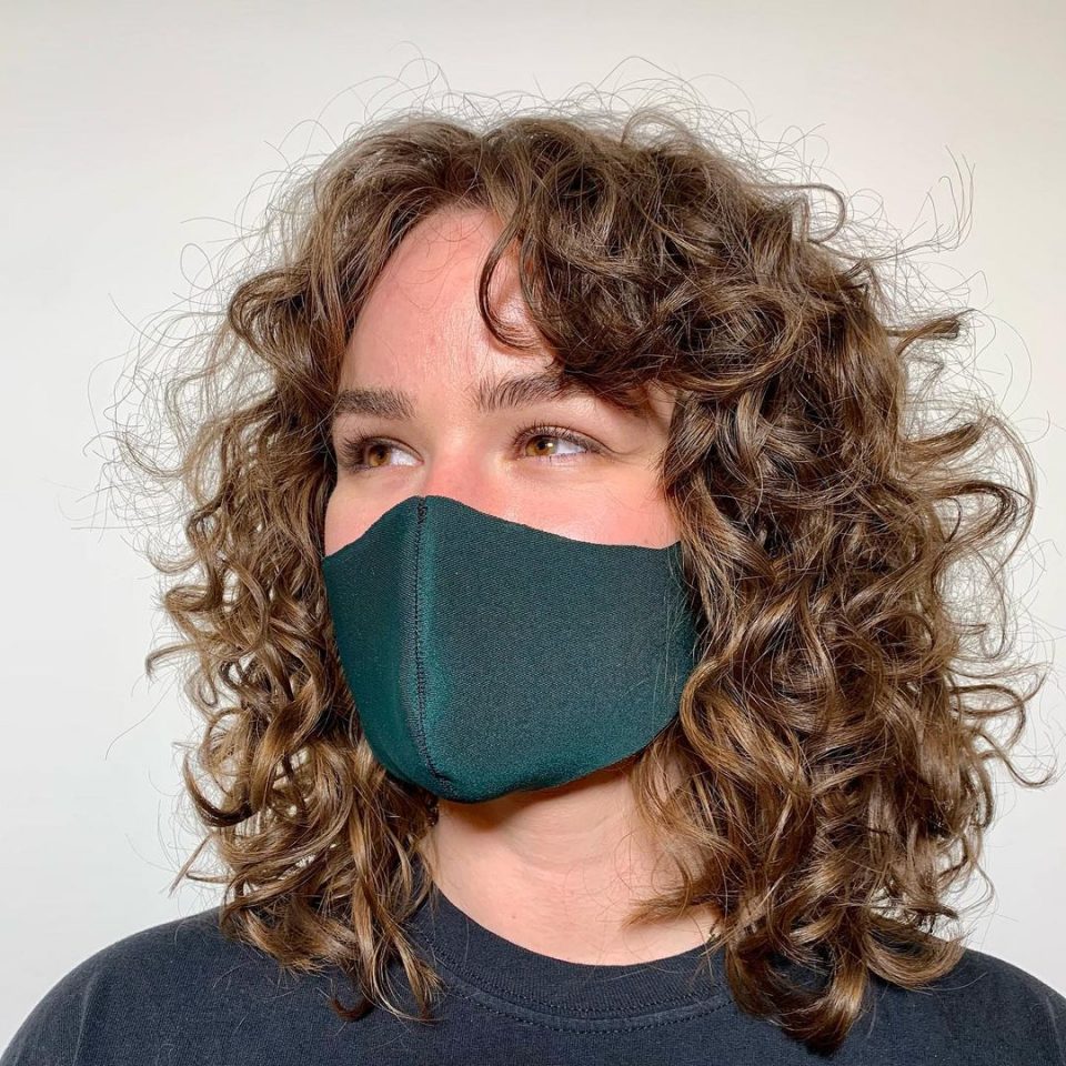 22 Flattering Ways To Pair Curtain Bangs With Curly Hair