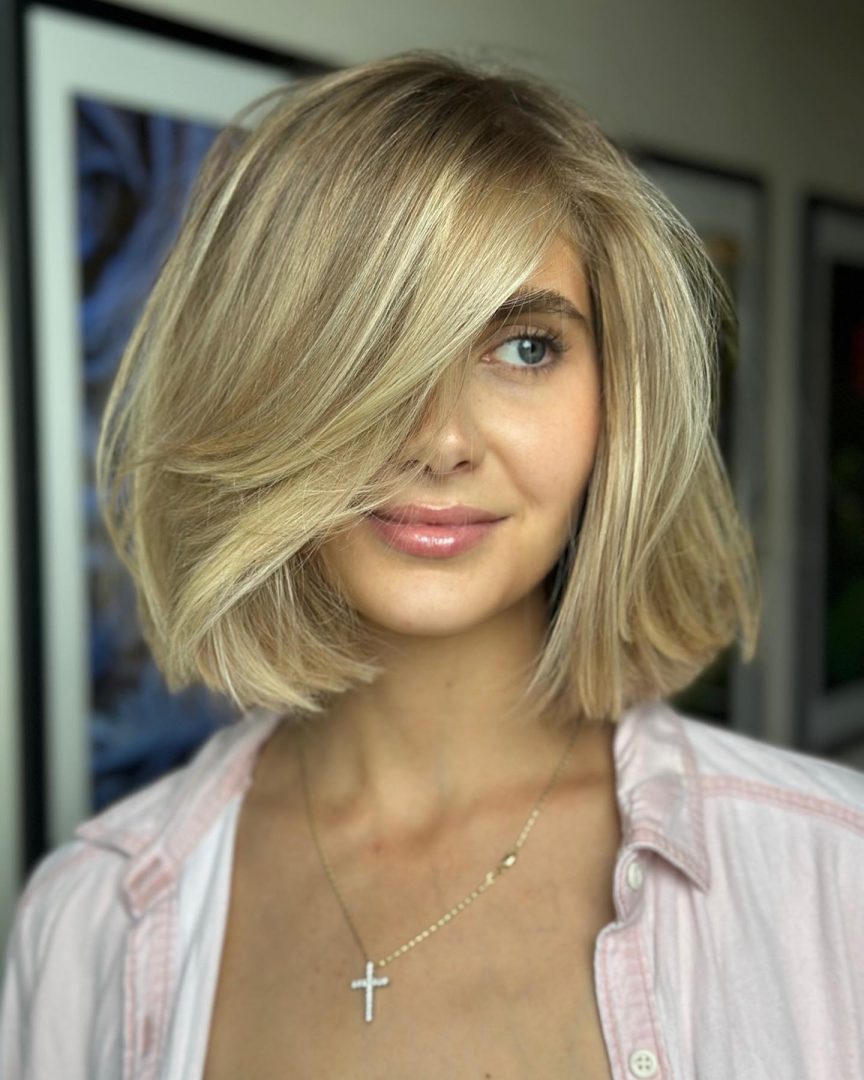 Face-Framing Layers With Side Part Are The Secret To Mega Volume