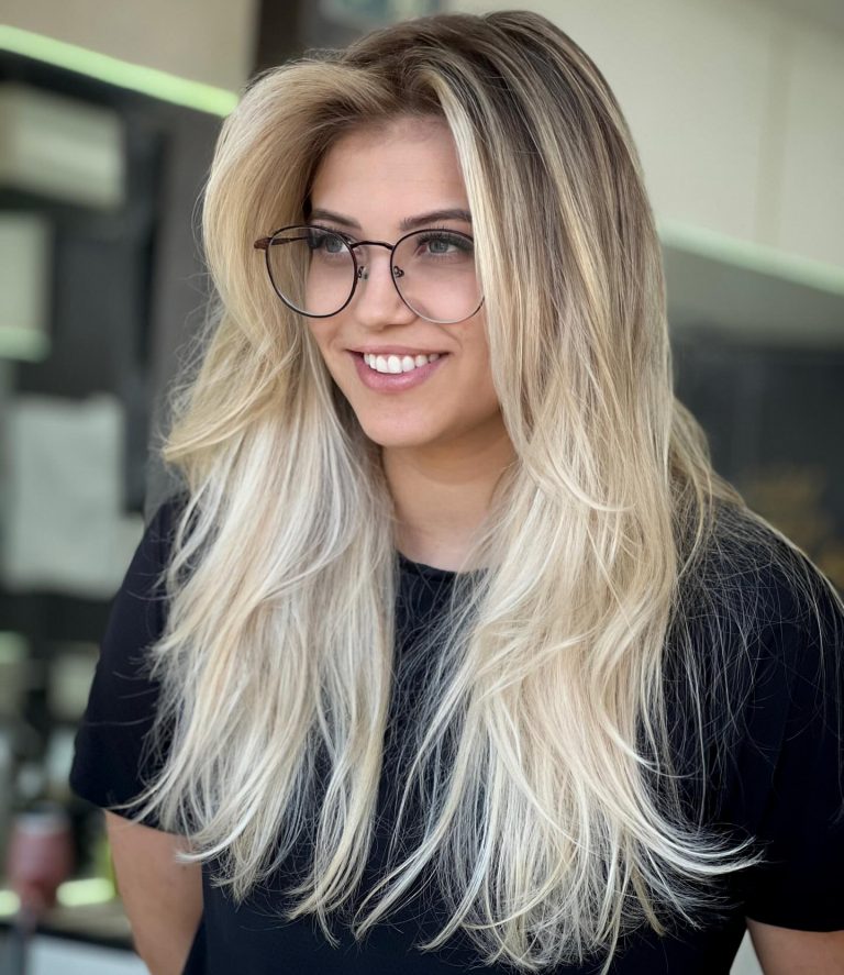 Face-Framing Layers With Side Part Are The Secret To Mega Volume