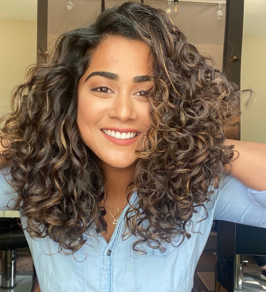 Face-Framing Layers With Side Part Are The Secret To Mega Volume