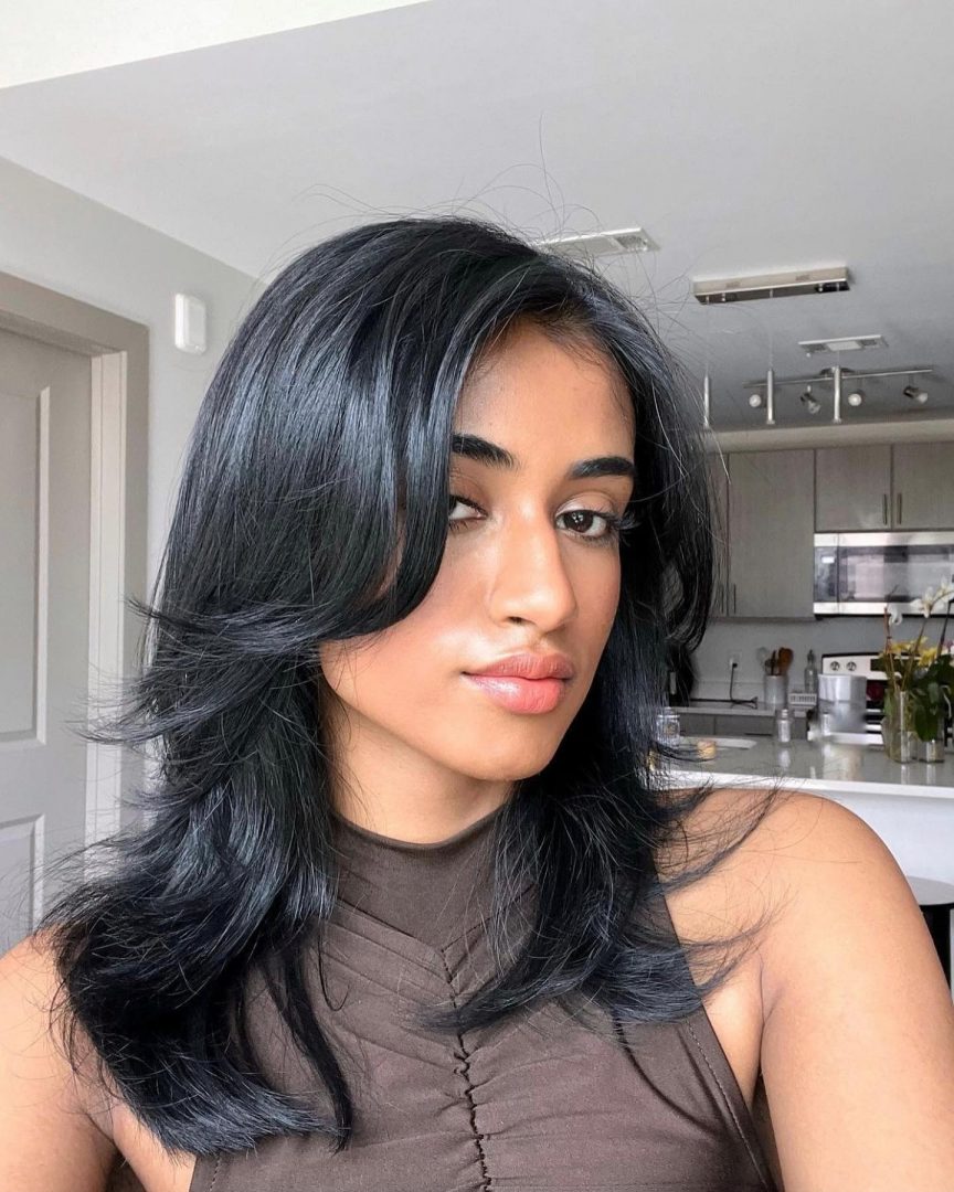 Face-Framing Layers With Side Part Are The Secret To Mega Volume