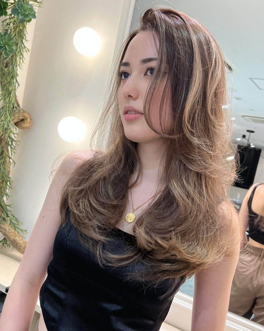 Face-Framing Layers With Side Part Are The Secret To Mega Volume