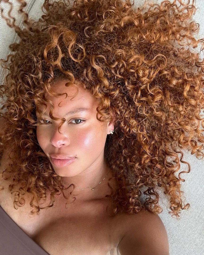 Curly Hair With Caramel Highlights Is 2025's Most Wanted Style