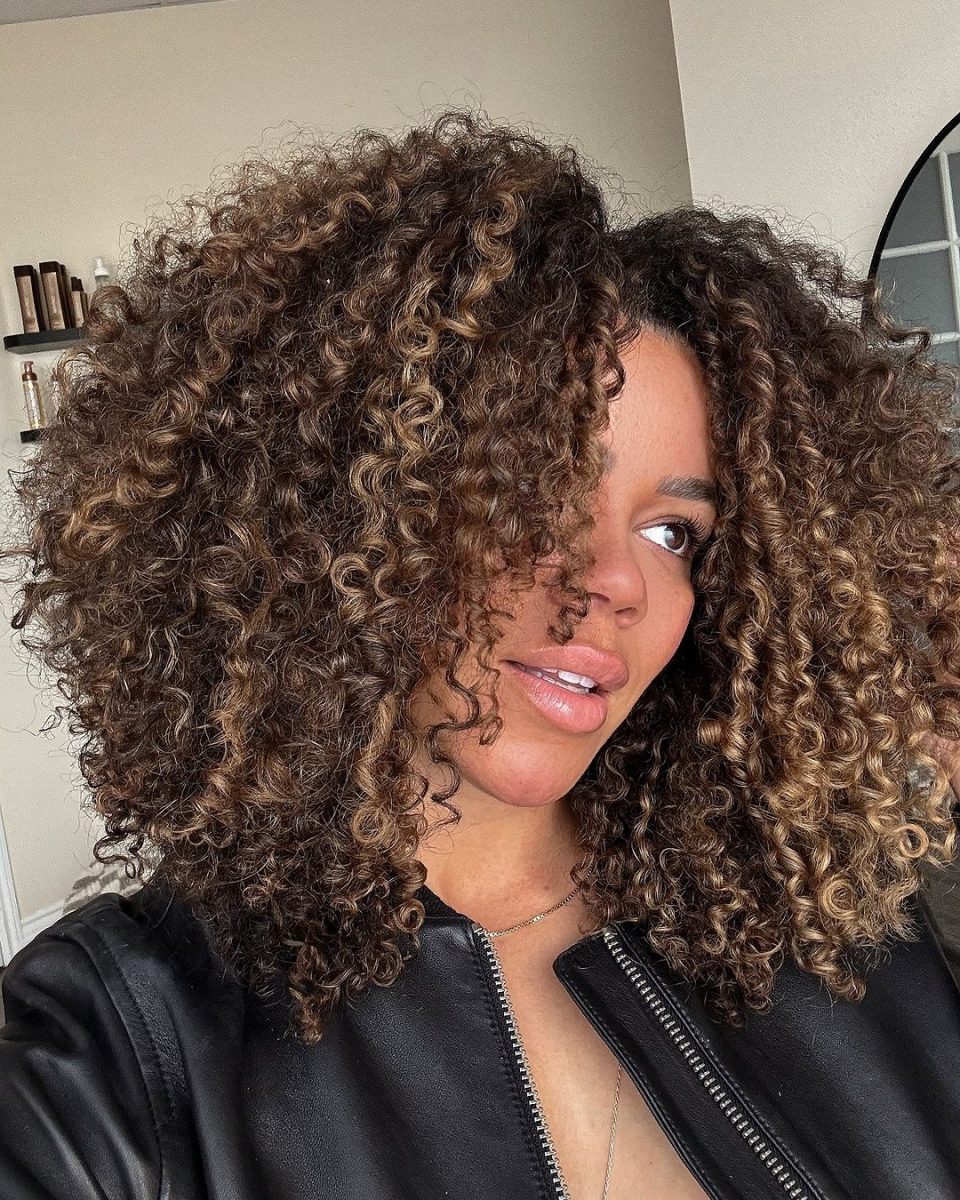 Curly Hair With Caramel Highlights Is 2025's Most Wanted Style