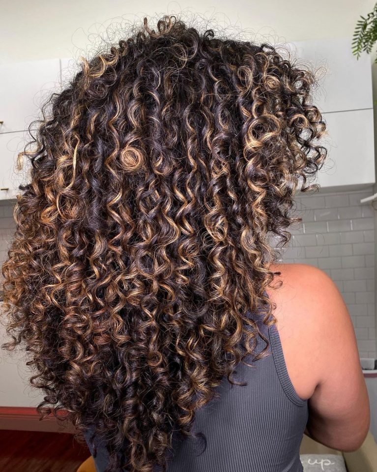 Curly Hair With Caramel Highlights Is 2025's Most Wanted Style