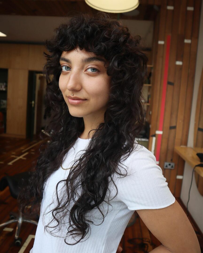 10 Curly Hair Mullet Ideas For An Iconic, Unconventional Look