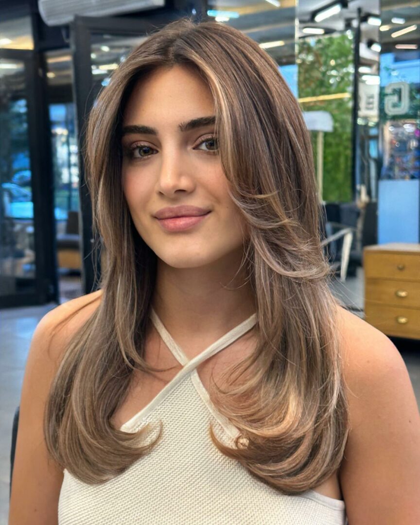 10 Gorgeous Ways To Wear Layered Hair With Curtain Bangs