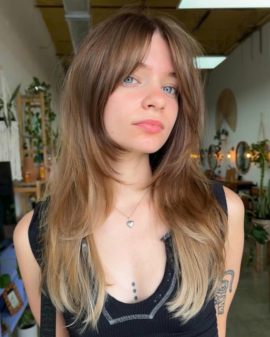 12 Fun And Fabulous Ways To Blend Curtain Bangs Into A Choppy Wolf Cut